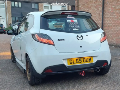 2010 Mazda 2 Sport with 15x7 Japan Racing Jr5 and Toyo Tires 195x55 on ...