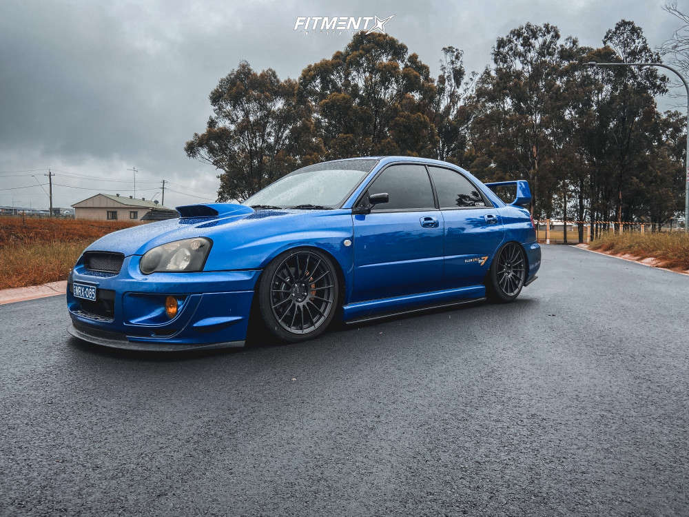 2004 Subaru Impreza WRX with 18x8.5 Enkei Rs05-rr and Bridgestone 225x40 on Air Suspension ...